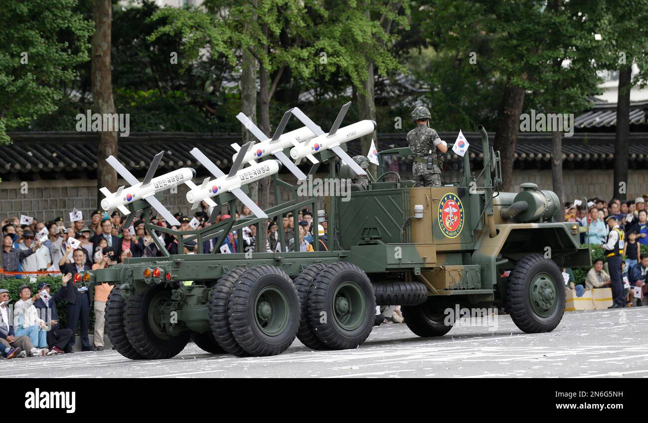 Israeli-made Spike missiles are displayed during a street parade ...