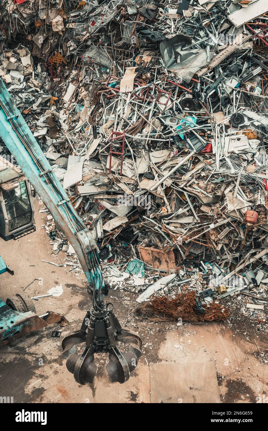 Metal scrap yard in an industrial area, vertical Stock Photo - Alamy