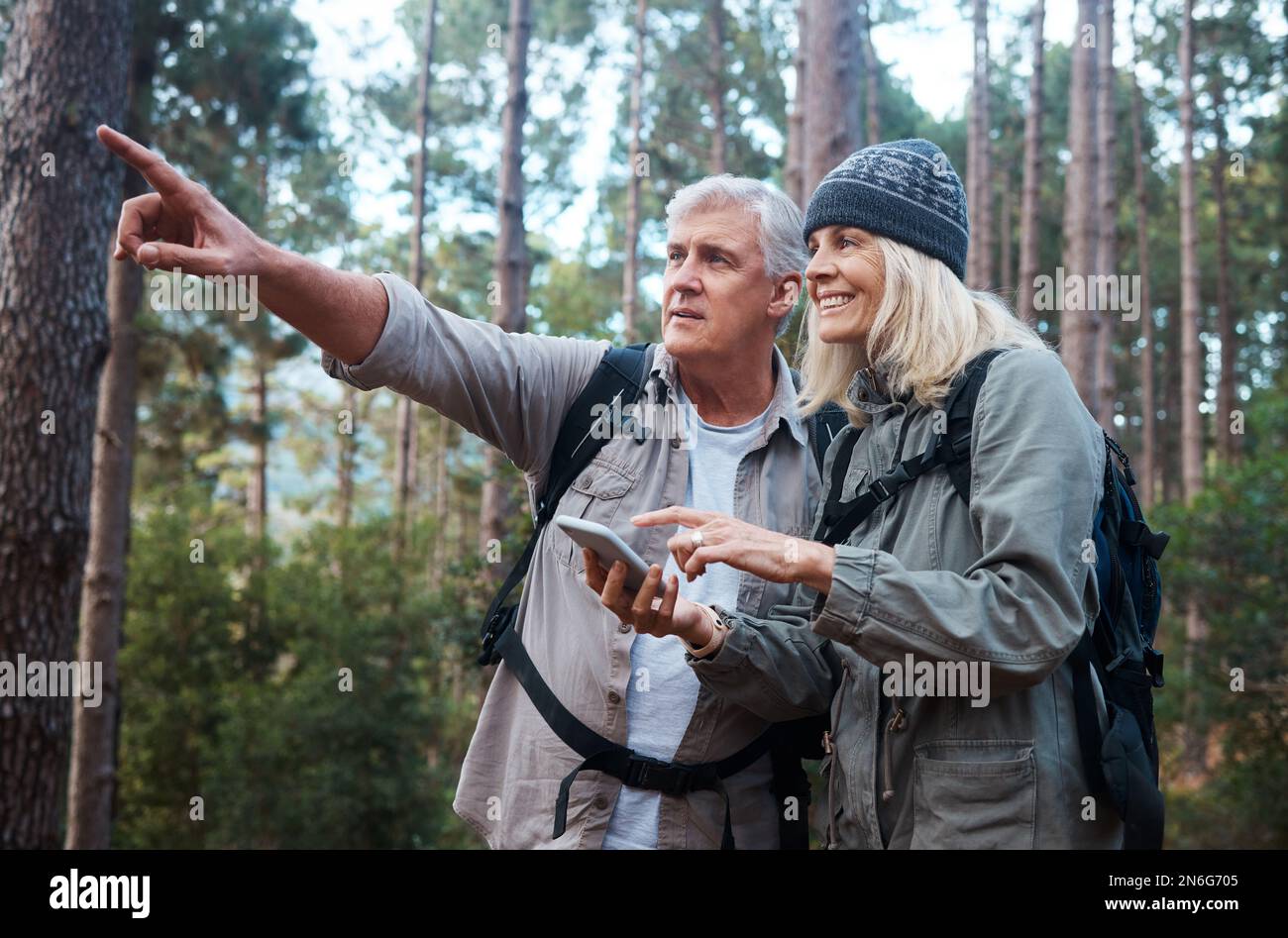 Finding our way with the help of a digital compass. a mature couple ...