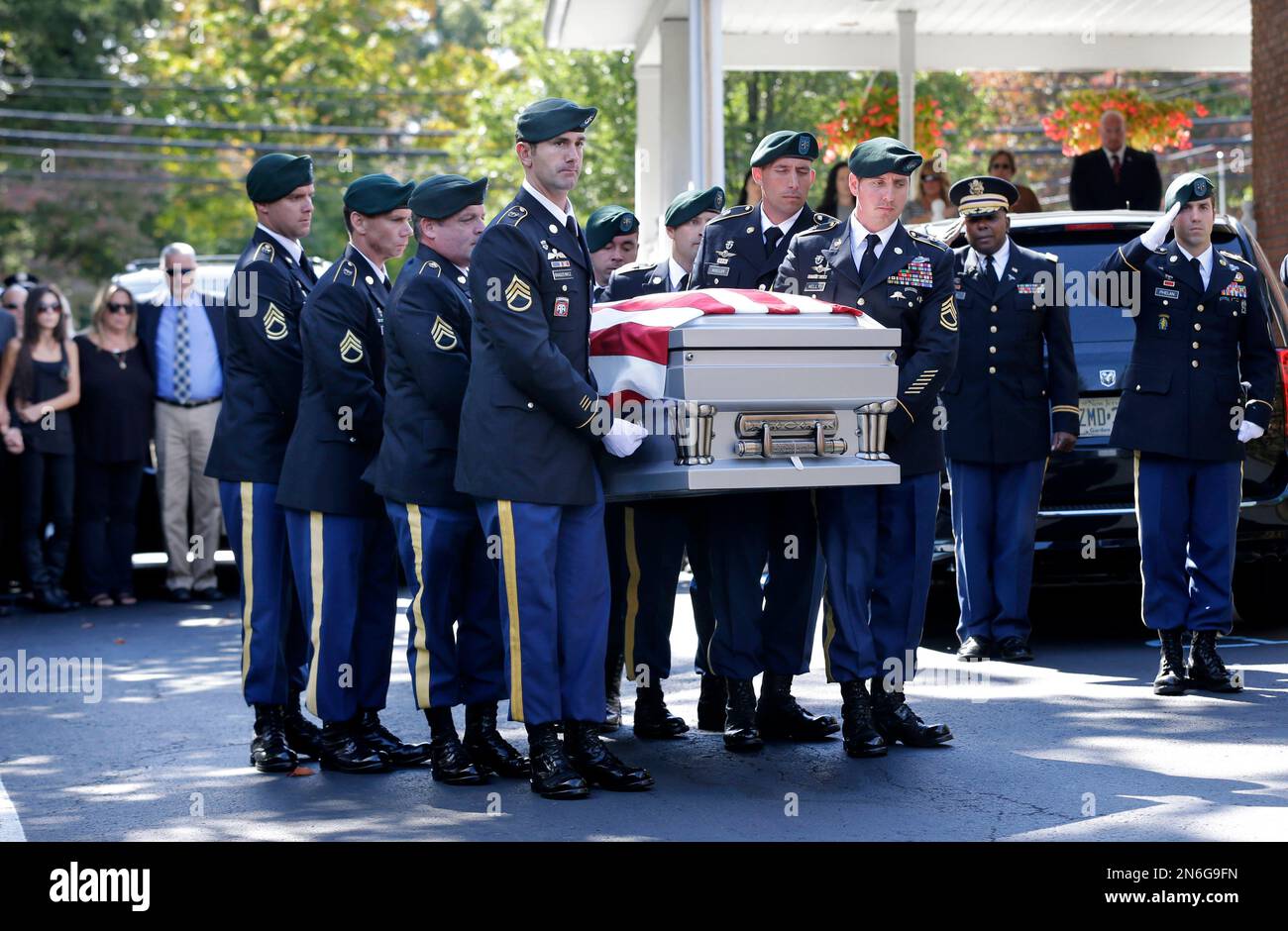 A U.S. Army honor guard carries the coffin of Army Staff. Sgt. Timothy ...