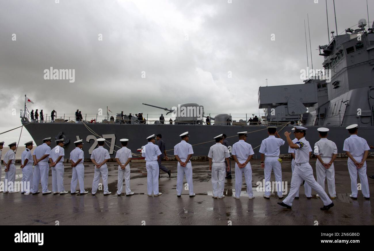 Myanmar navy officers stand in a line to welcome Japan Maritime Self ...