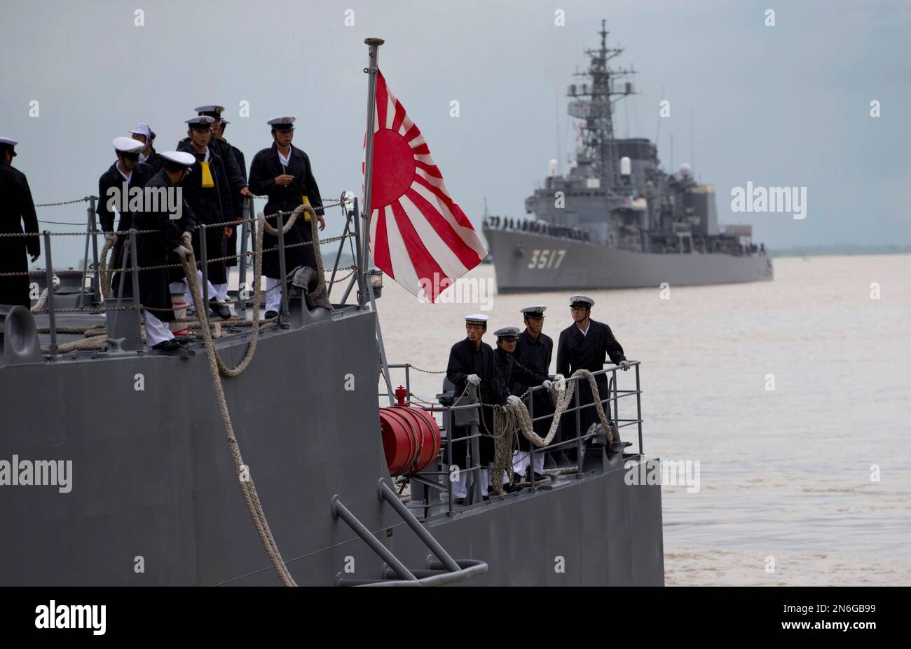Japanese navy officers stand on the deck of Japan Maritime Self-Defense ...