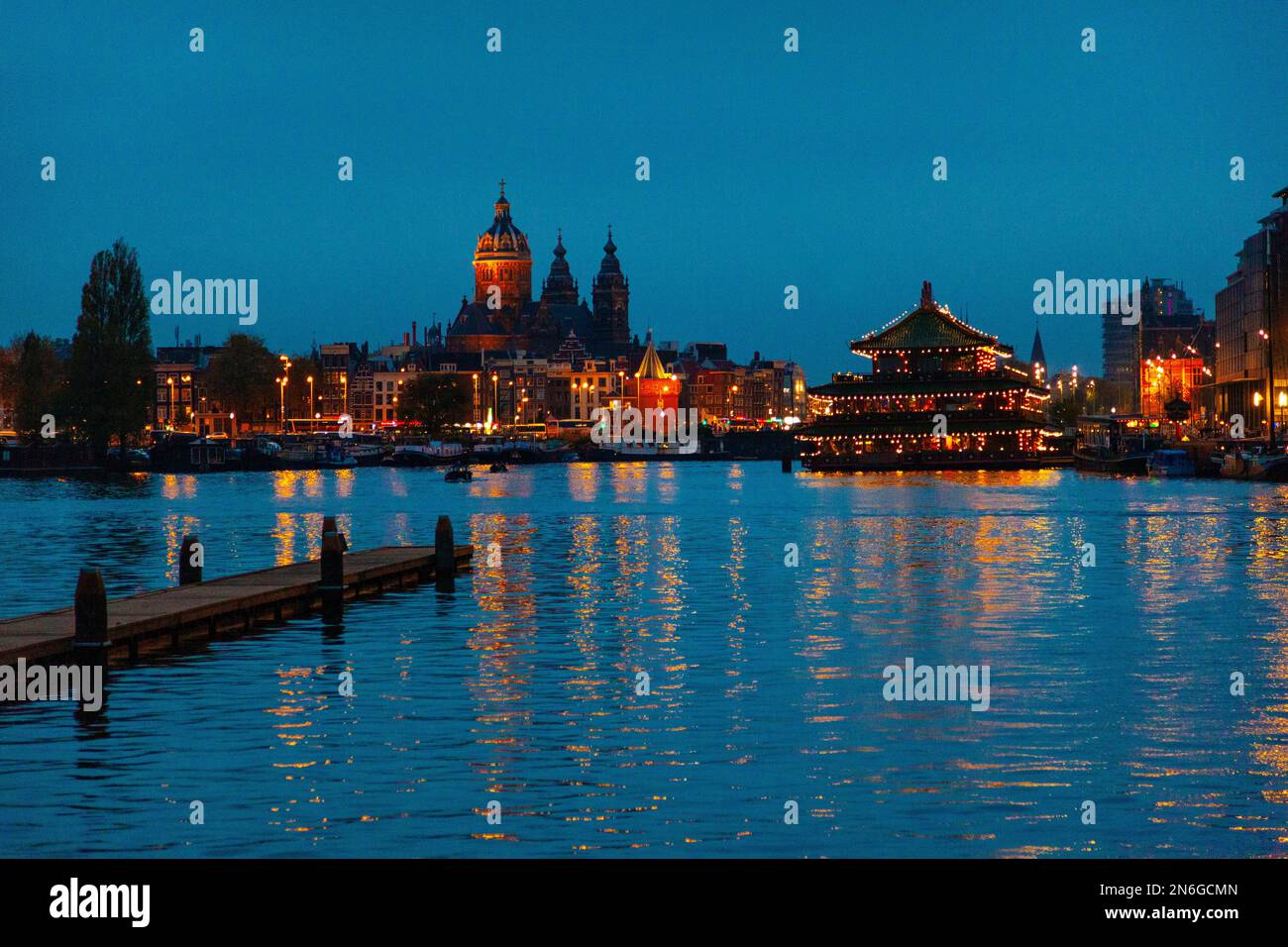 View over Oosterdok and city skyline at night, Amsterdam, Netherlands ...