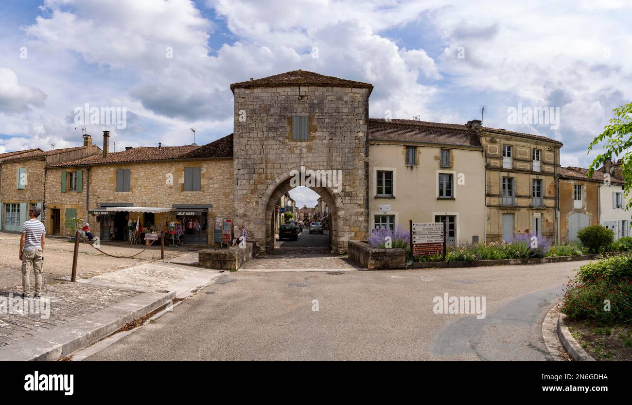 Access road and city gate of the historic old town of Monpazier ...
