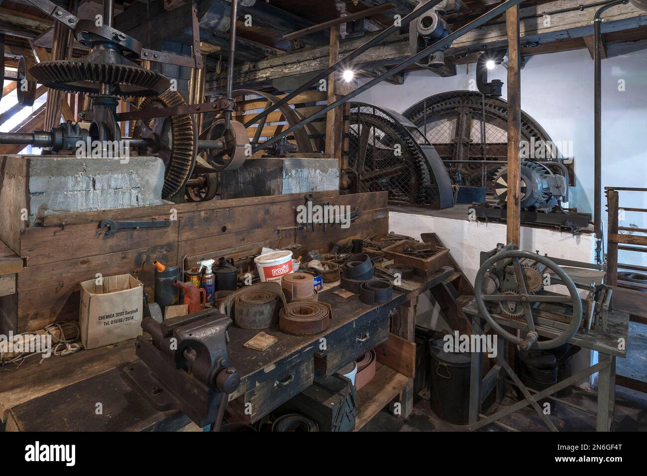 Workbench in a grain mill, transmission drives at the back, Industrial ...