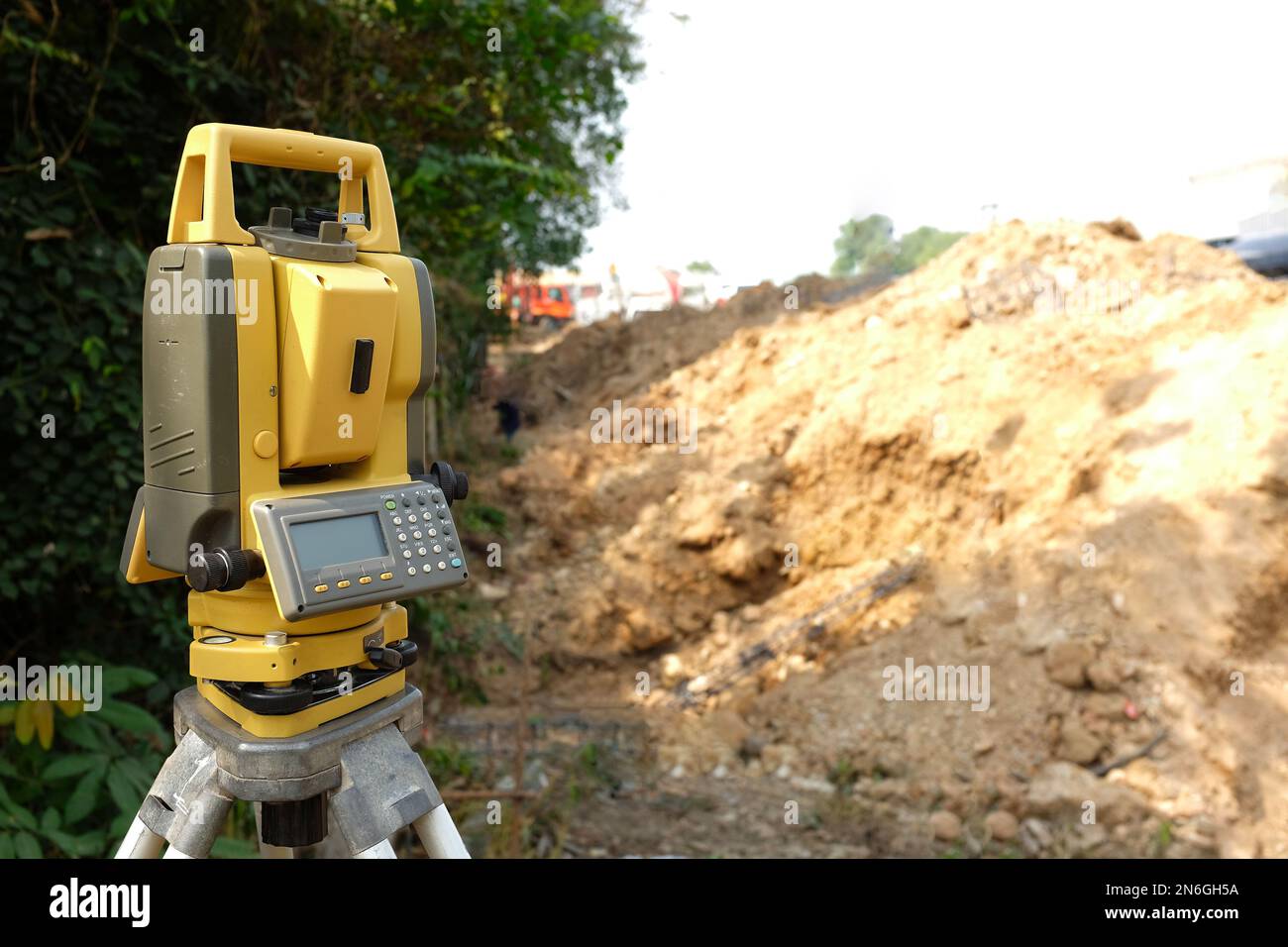 Survey instrument, Theodolite, mounted on a tripod at a construction ...