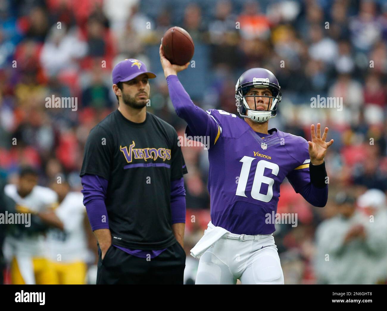 Injured Minnesota Vikings quarterback Christian Ponder, left, watches ...