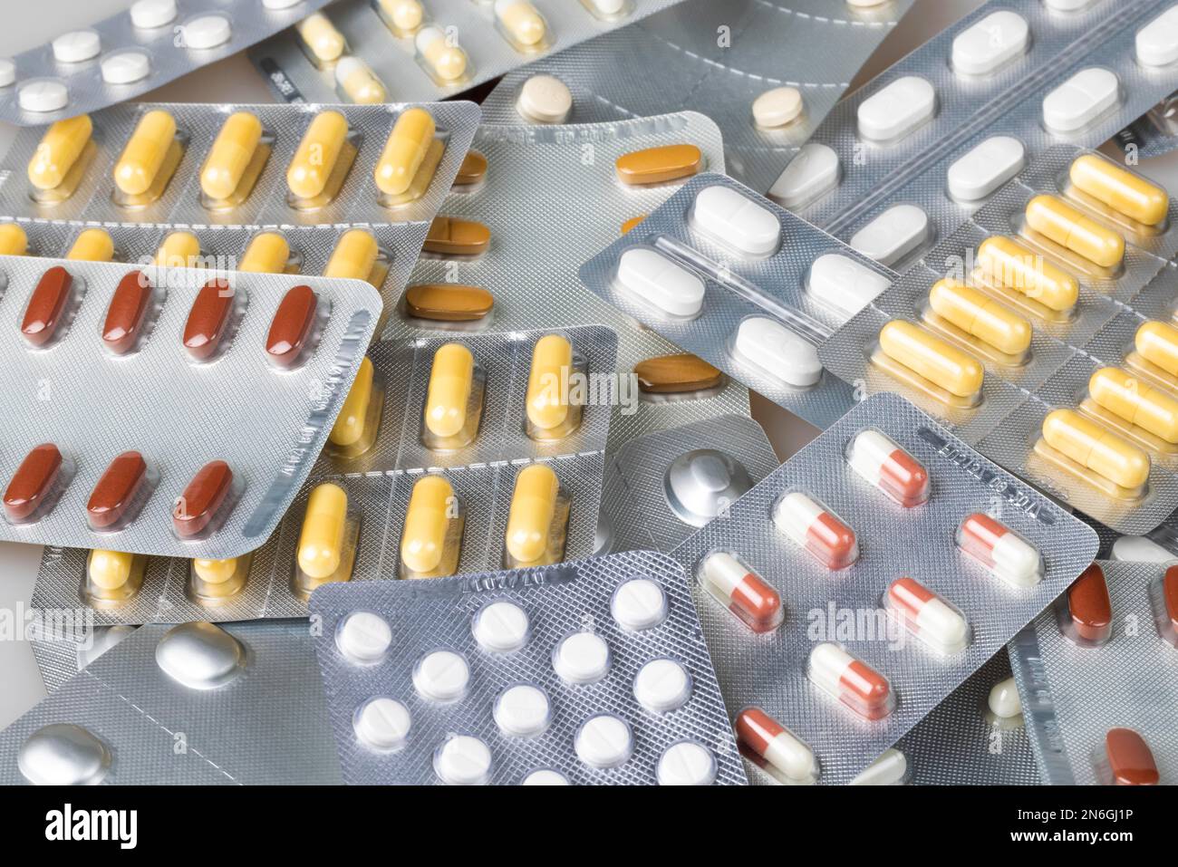Colourful pills and capsules in blister packs Stock Photo - Alamy