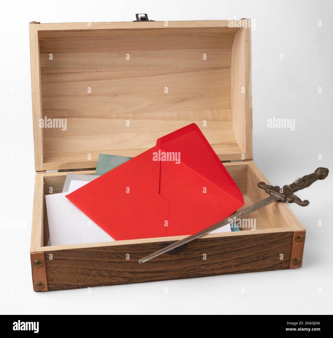 Opened wooden box, coloured envelopes and old sword-shaped letter ...