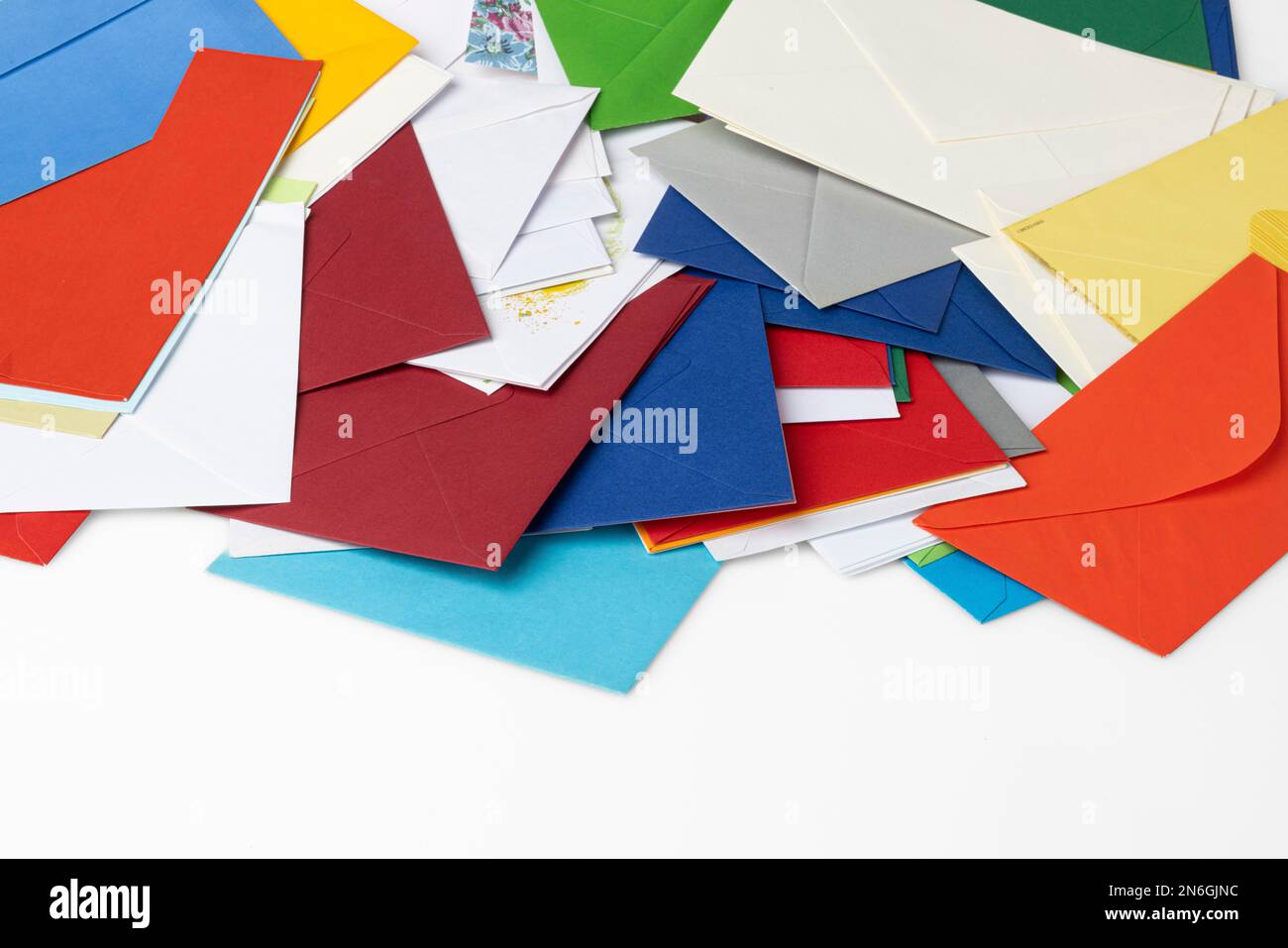 Many different coloured envelopes, free space at the bottom, white ...