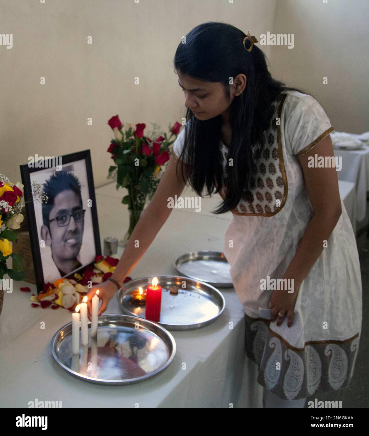 Sonali Shah, fiance of 24 year old Rajan Lalitkumar Solanki, lights a ...