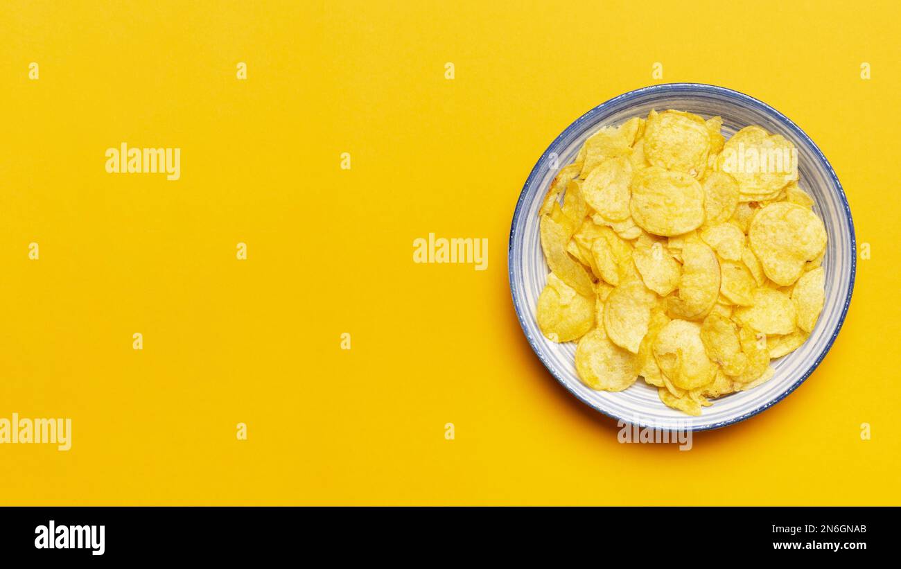 top view chips bowl yellow background. Resolution and high quality ...
