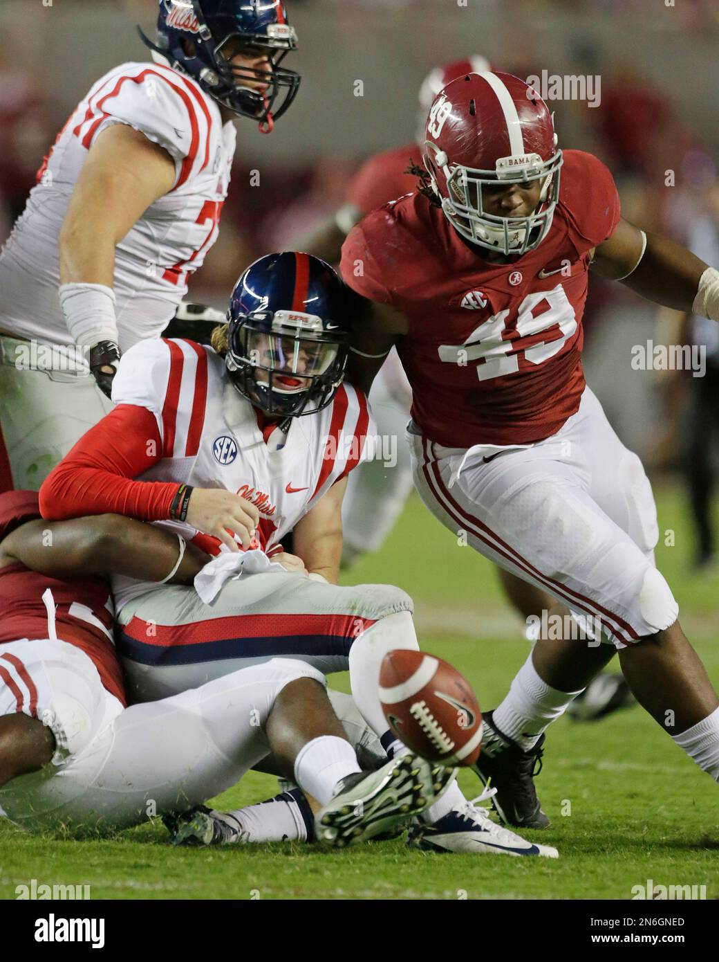 Mississippi quarterback Bo Wallace (14) fumbles after being hit by ...