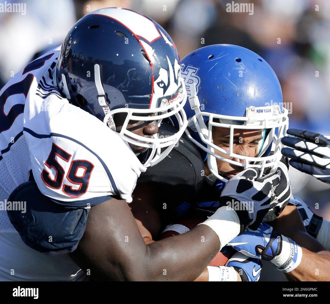 Connecticut defensive tackle Shamar Stephen (59) tackles Buffalo ...