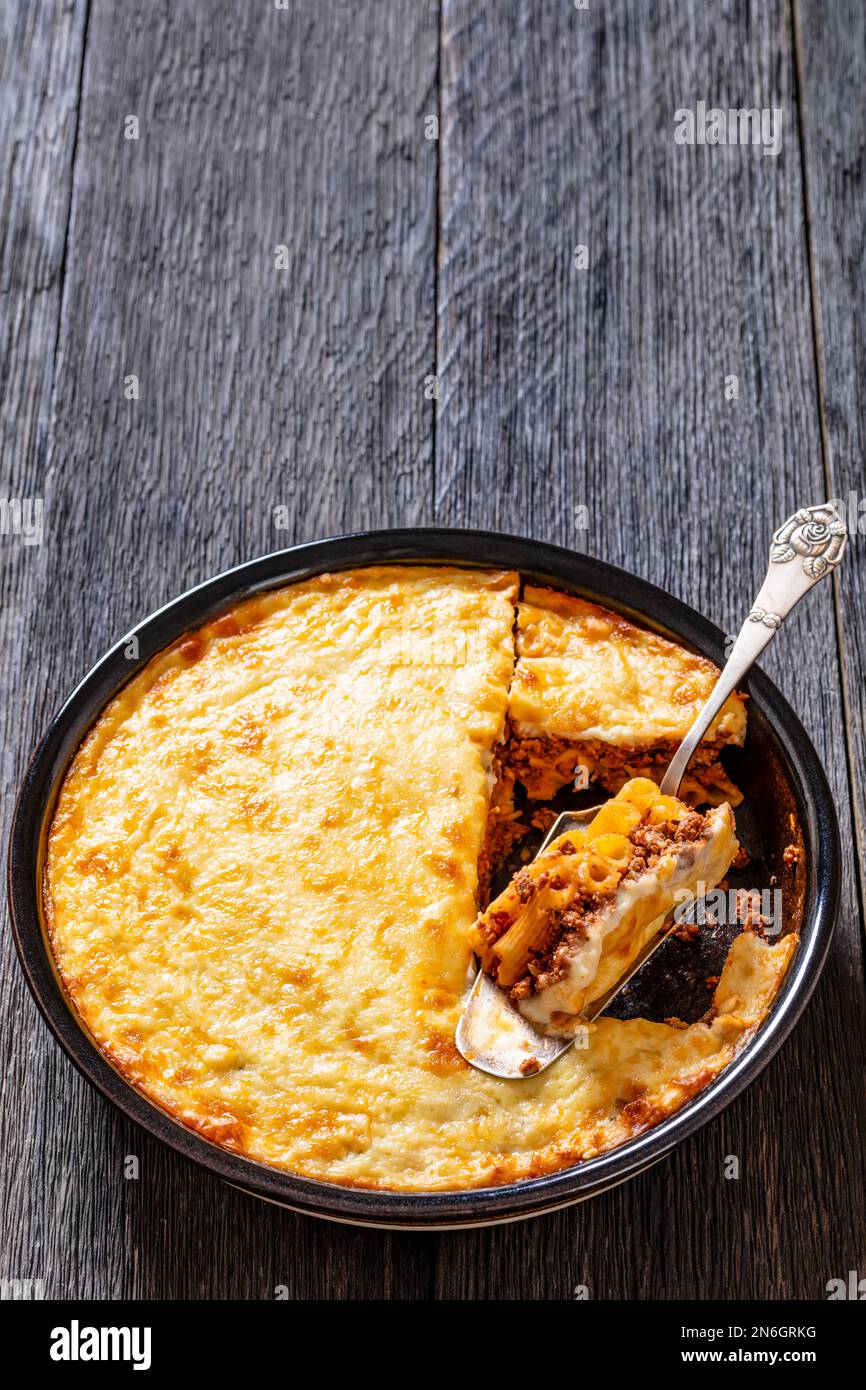 Greek Pastitsio of macaroni, ground lamb, grated cheese, and tomatoes ...