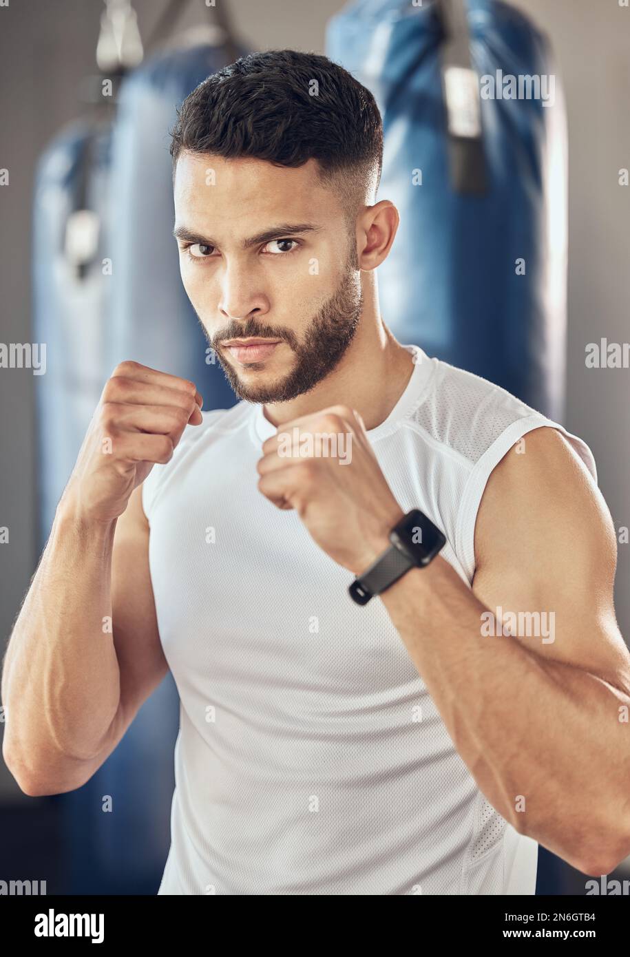 Strong athlete ready to punch in the gym. Boxer ready to workout in the ...