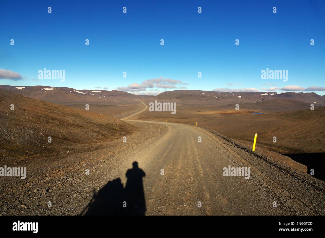 Shadow of a cyclist in lonely landscape, rough, barren landscape, East ...
