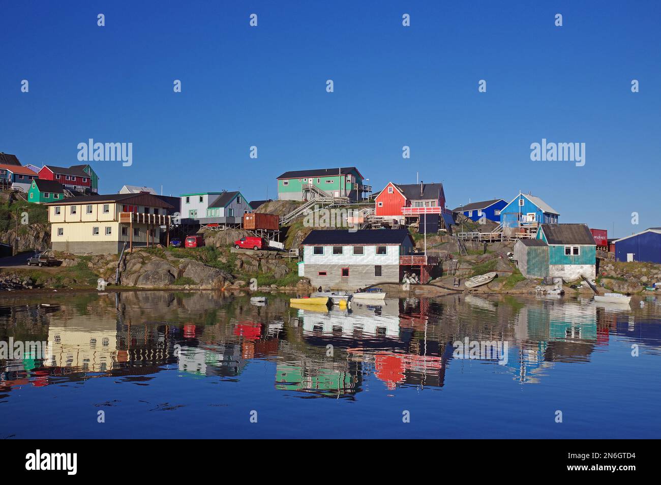 Houses reflected in the sea, fishing, Maniitsoq, Arctic, North America ...