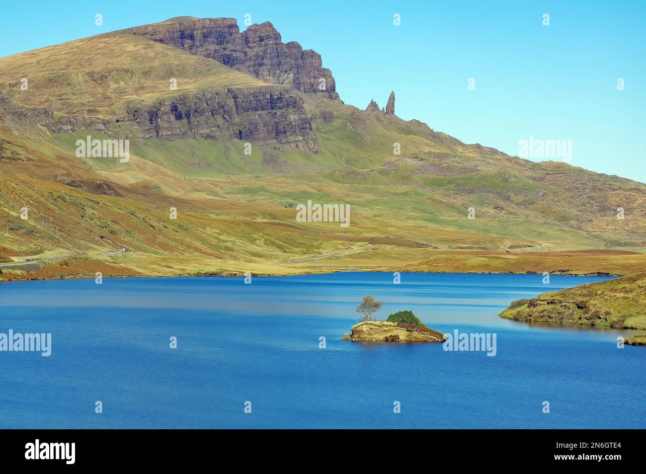Small island in the loch and prominent rocks and mountains, old men of ...