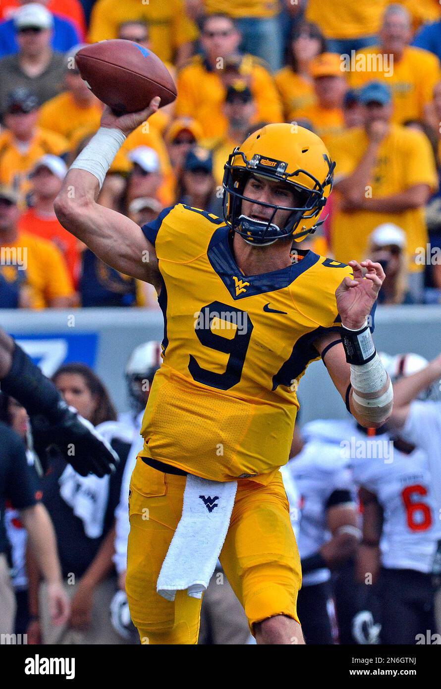 West Virginia quarterback Clint Trickett (9) attempts a pass during the ...