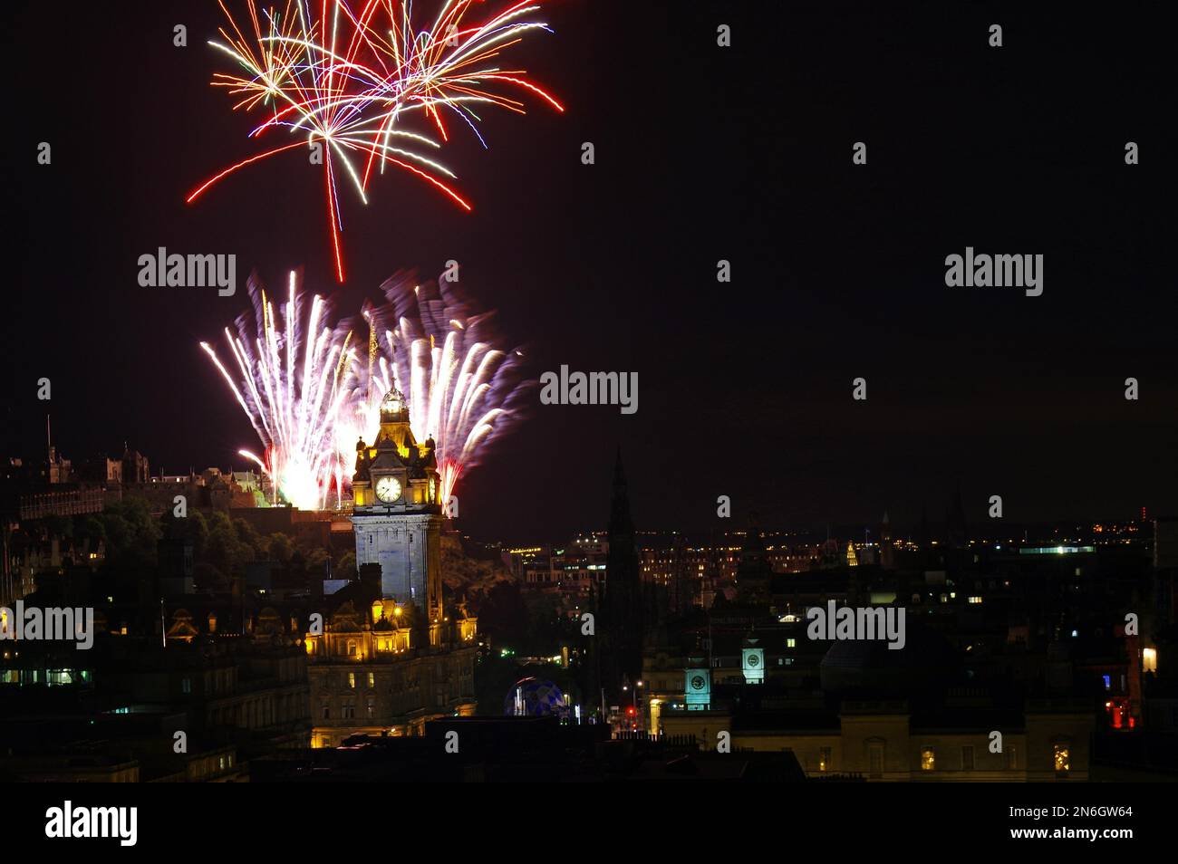Fireworks over buildings, Balmoral Hotel, Edinburgh, Scotland, United ...