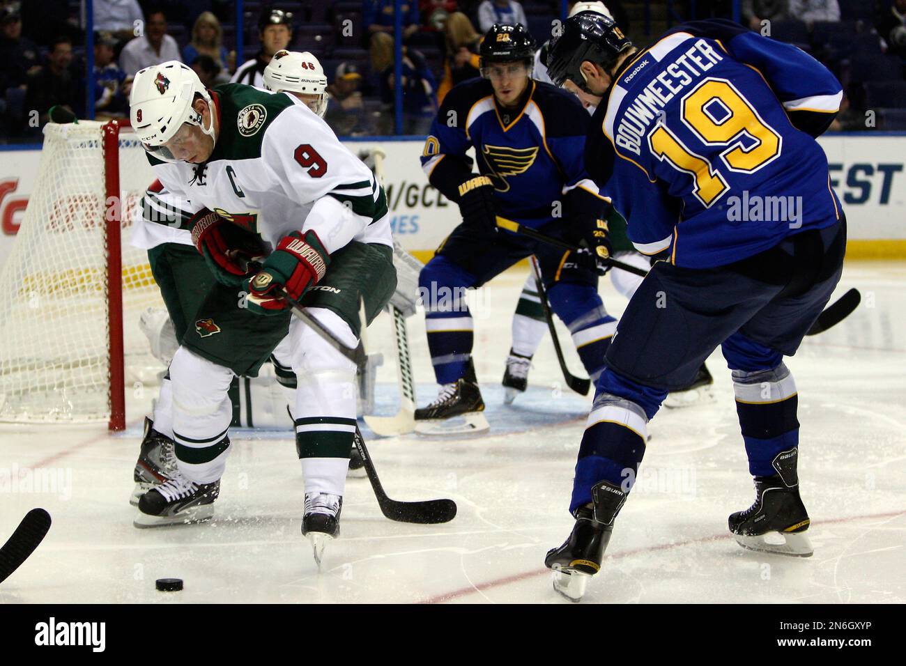 Minnesota Wild's Mikko Koivu, right, of Finland, reaches for a loose ...