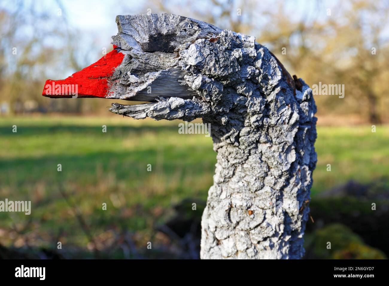 Art in the open landscape on natural structures, oak branch painted as ...