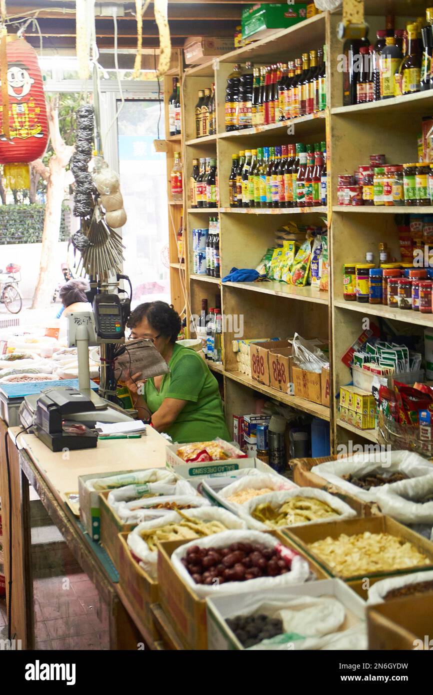 Small shop with bottles and canned goods on the shelf, Shanghai, China ...