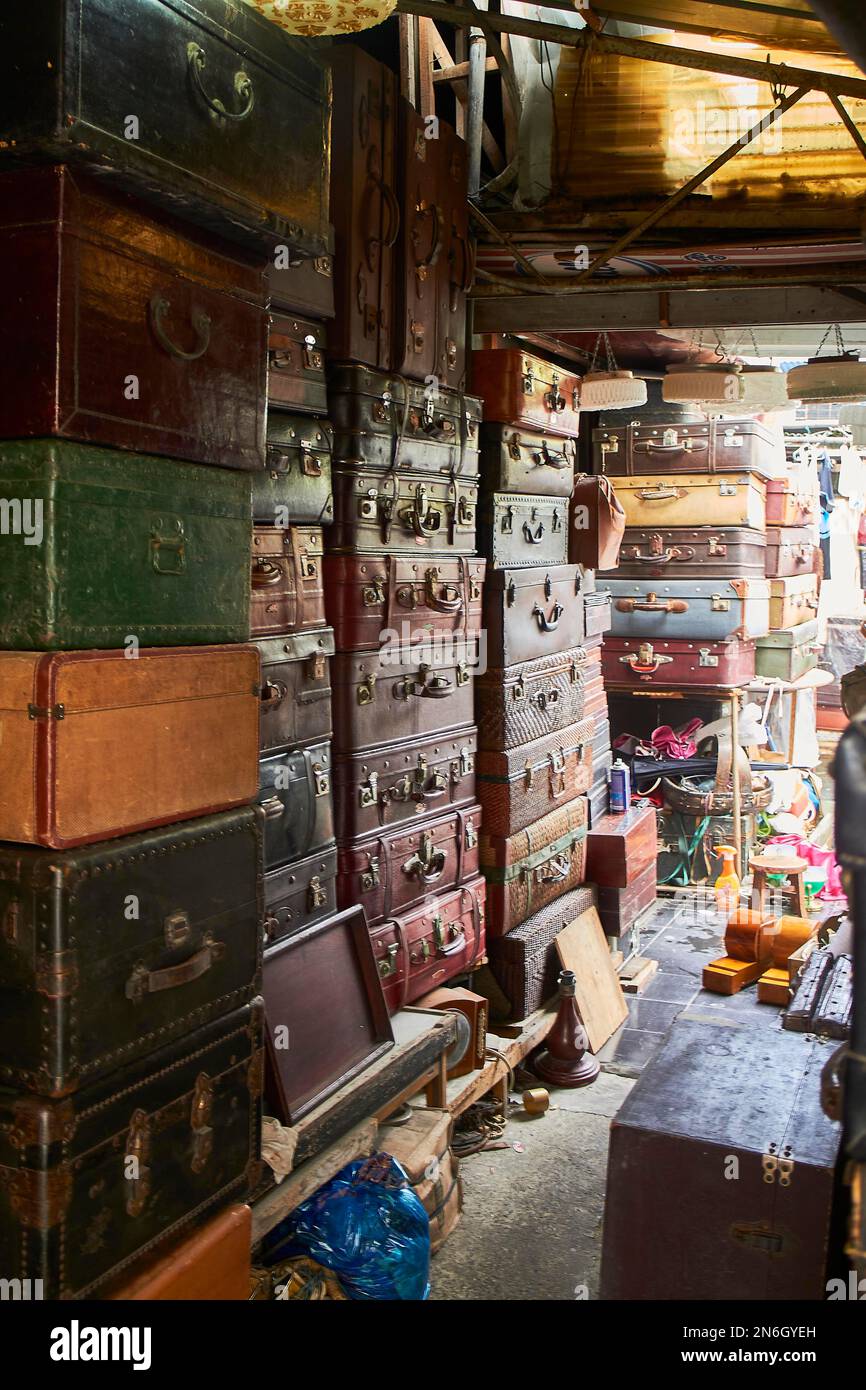 Suitcases stacked in antique shop, Shanghai, China Stock Photo - Alamy