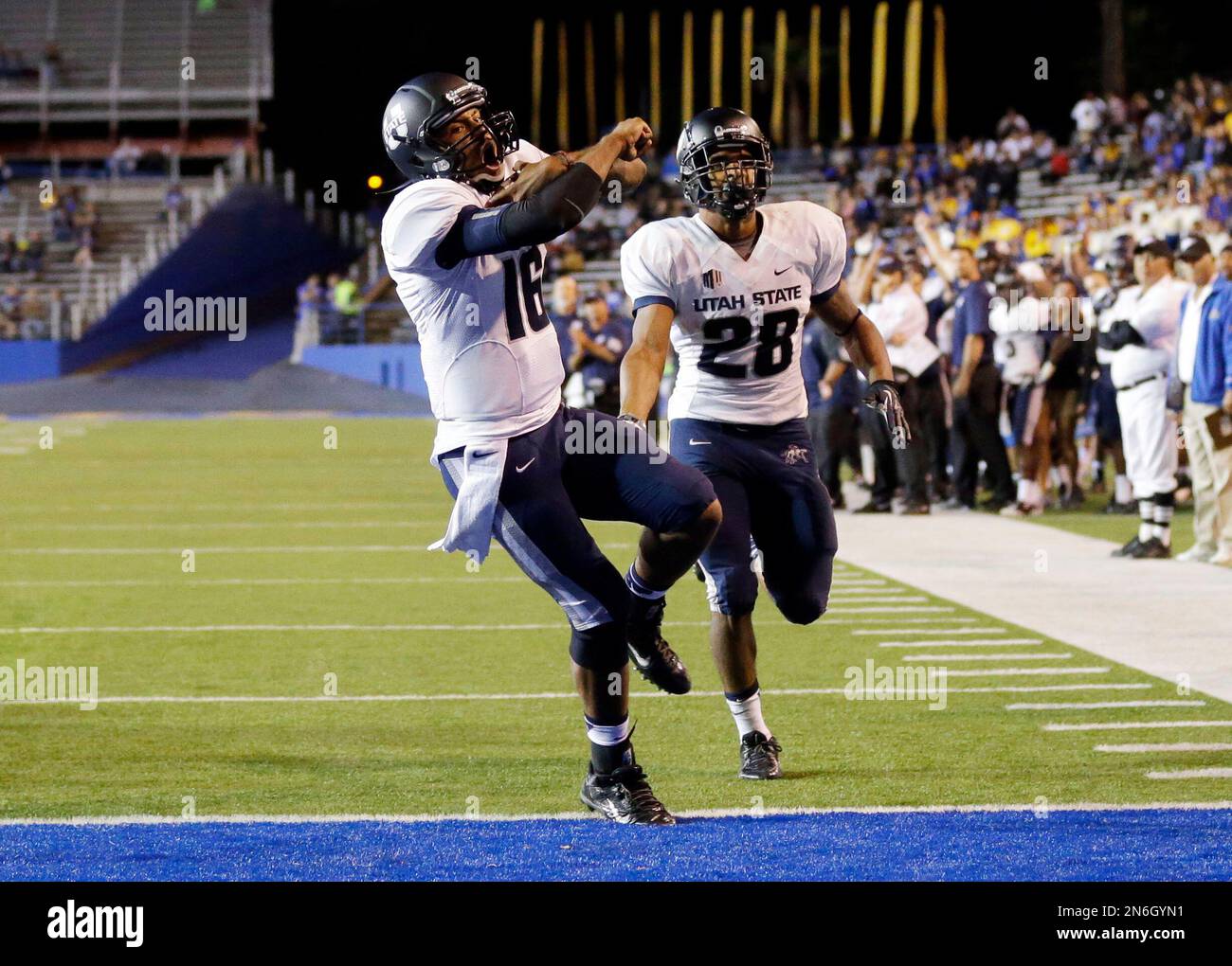 Utah State quarterback Chuckie Keeton (16) scores against San Jose ...
