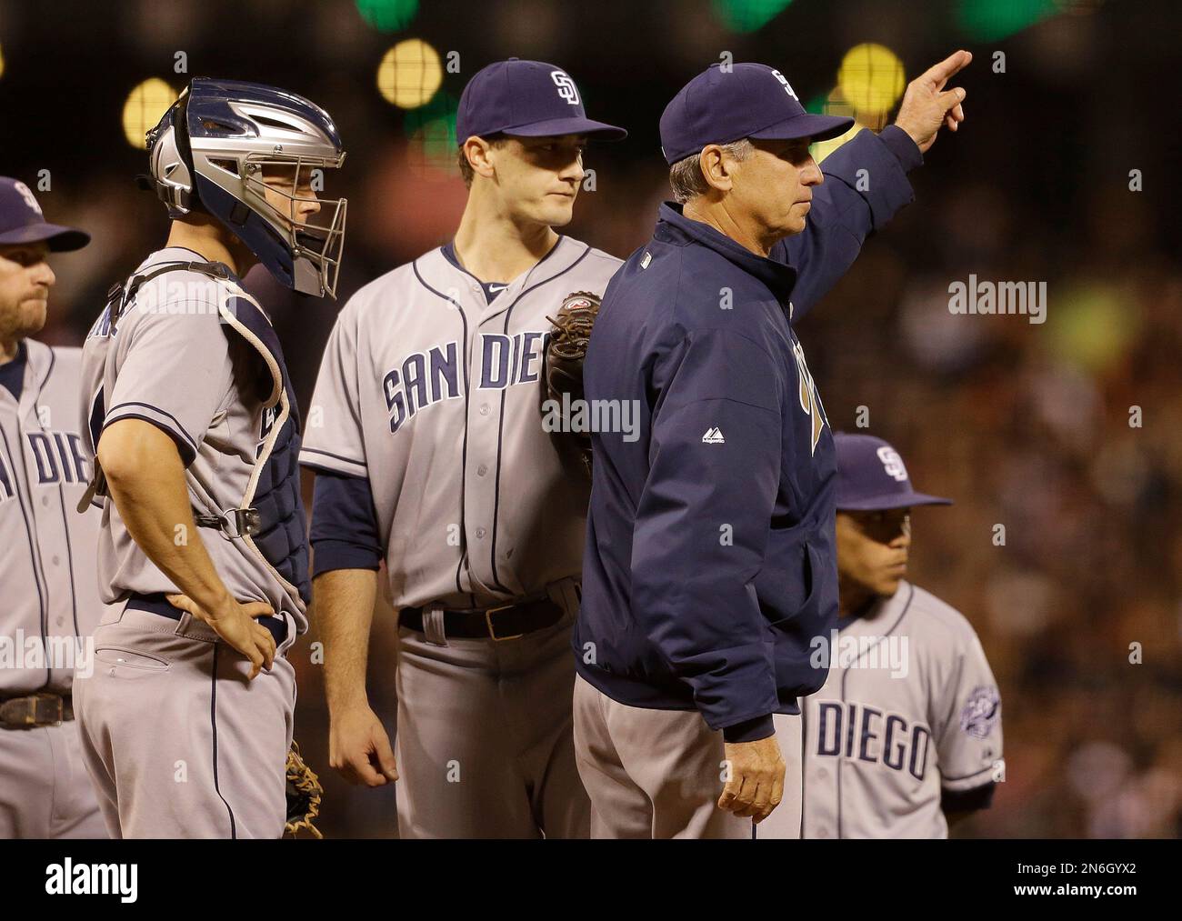 San Diego Padres manager Bud Black, right, signals to the bullpen for ...