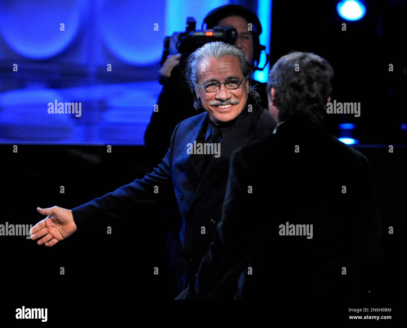 Edward James Olmos, left, and Lou Diamond Phillips walk on stage to ...
