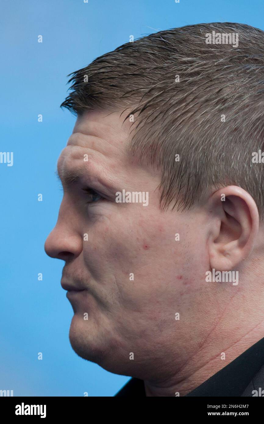 Boxer Ricky Hatton stands by the pitch before Manchester City's English ...