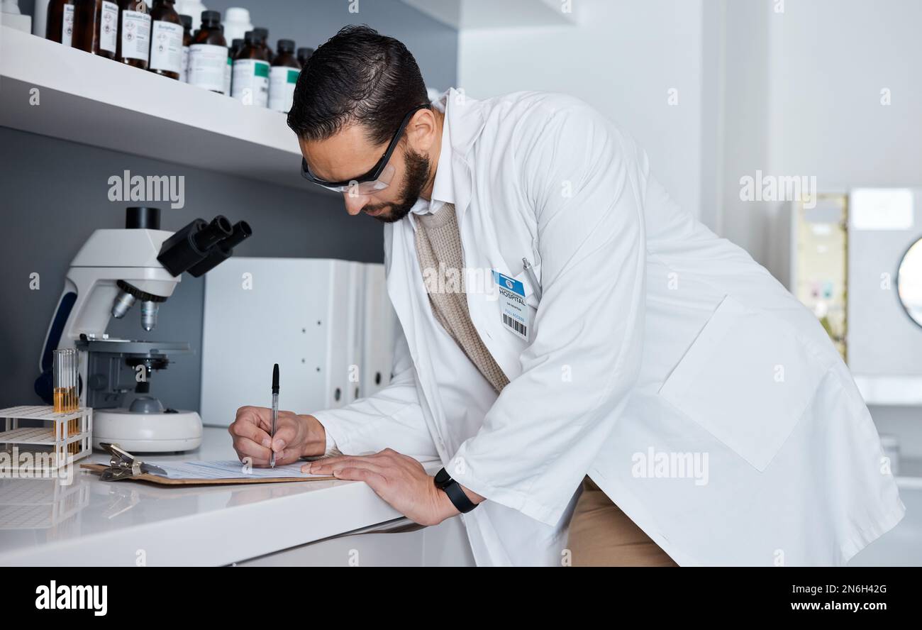 Science, writing and man in laboratory for research, medical report and ...