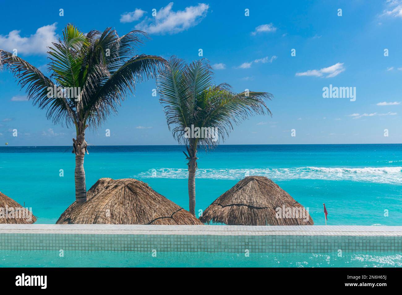 Swimming pool over the turquoise waters of Cancun, Quintana Roo, Mexico ...