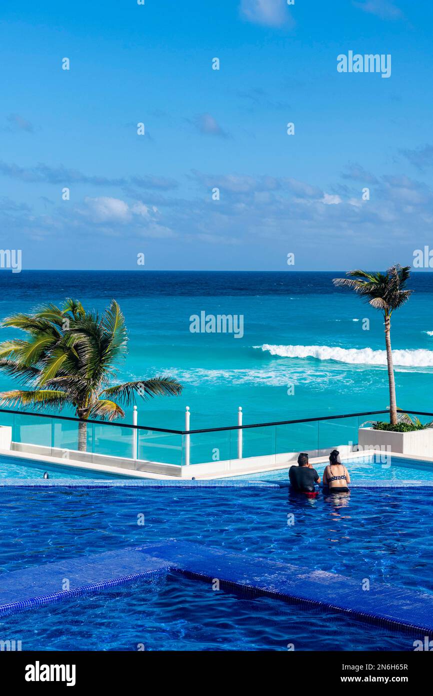 Swimming pool over the turquoise waters of Cancun, Quintana Roo, Mexico ...