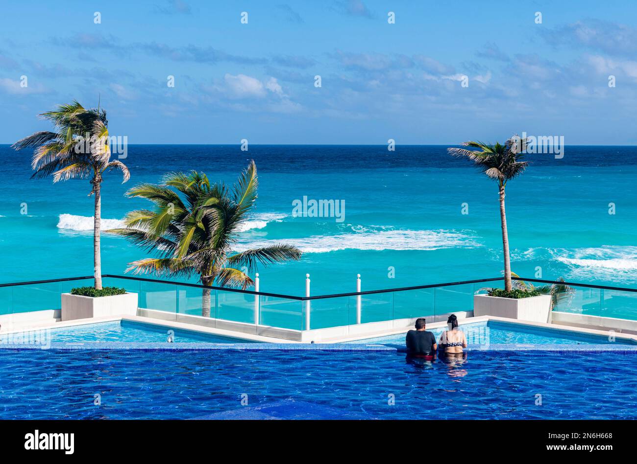 Swimming pool over the turquoise waters of Cancun, Quintana Roo, Mexico ...
