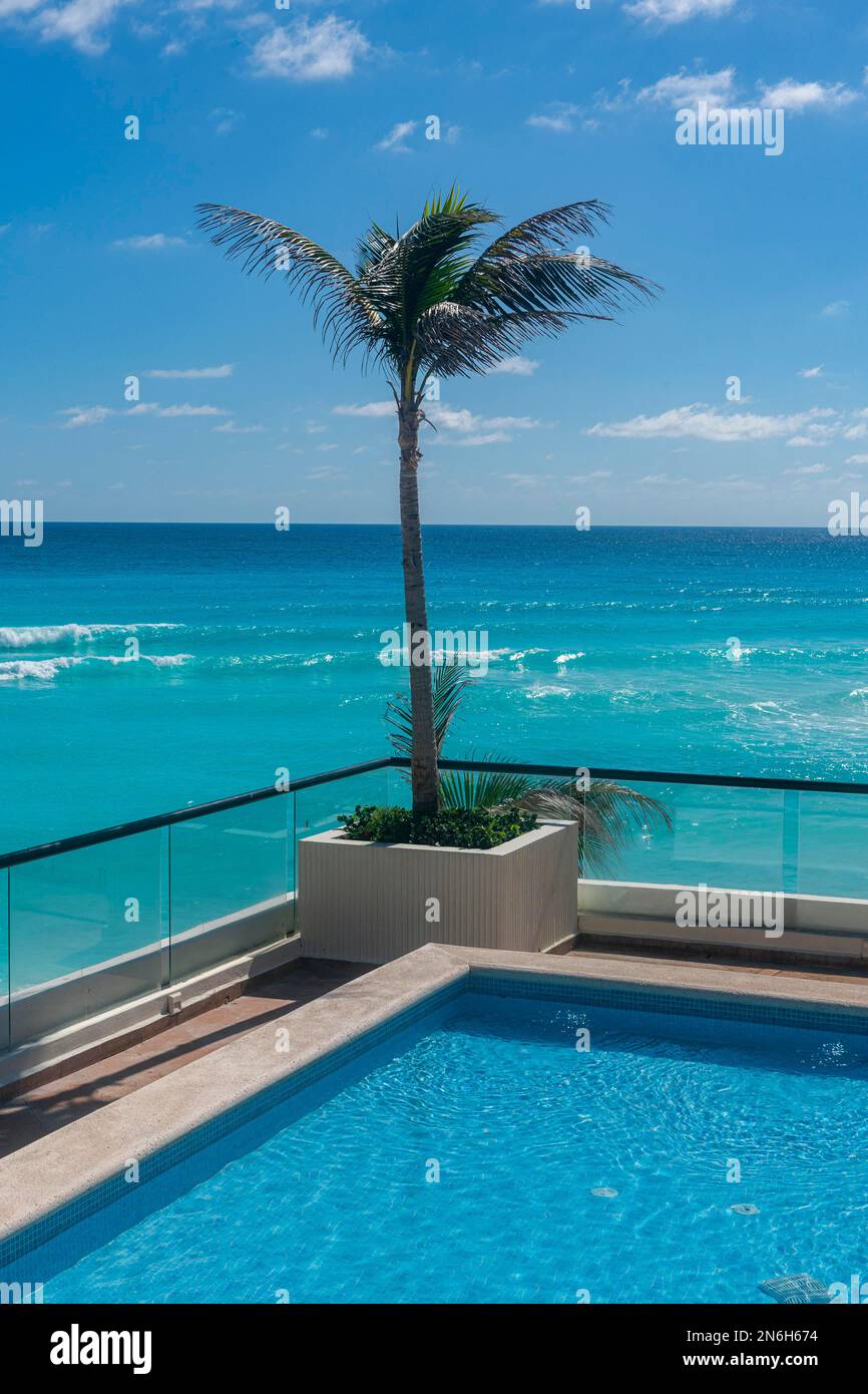 Swimming pool over the turquoise waters of Cancun, Quintana Roo, Mexico ...