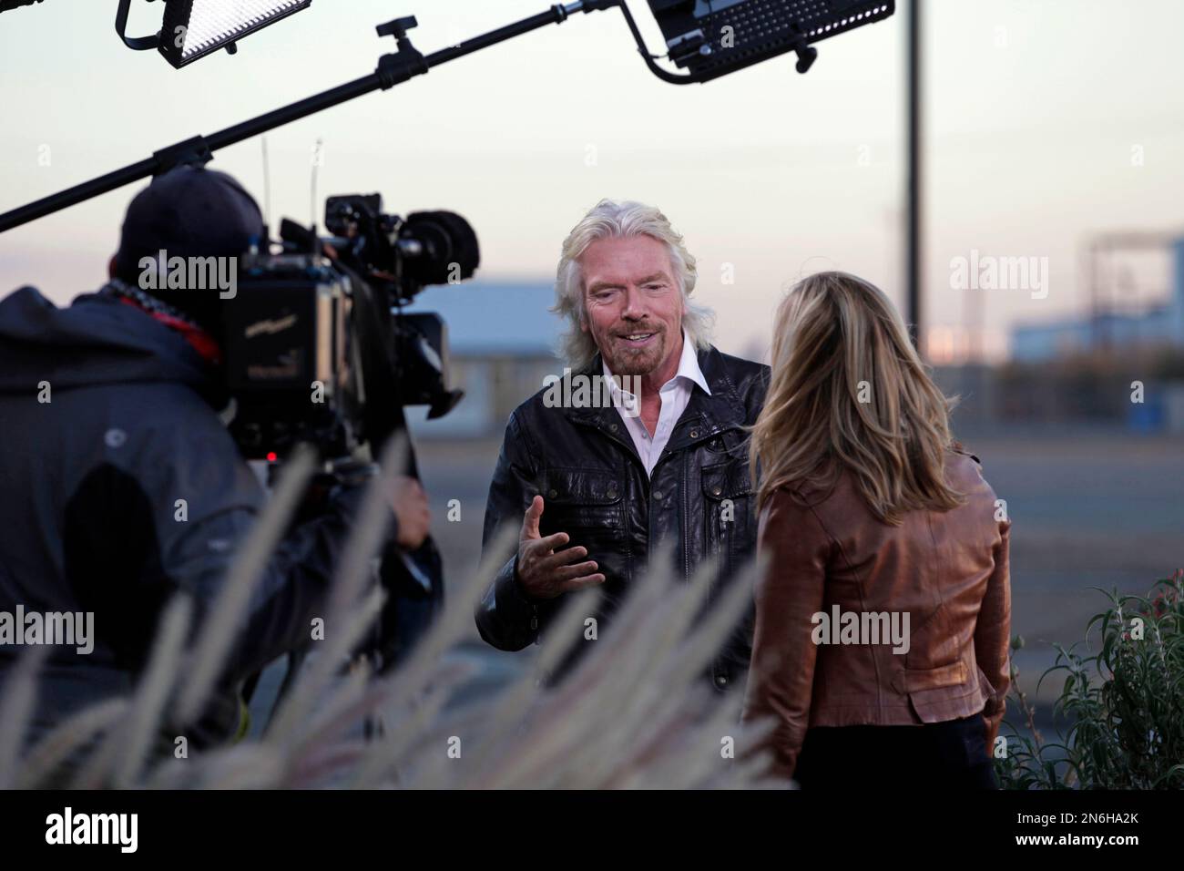 British entrepreneur Richard Branson does a broadcast interview at a ...