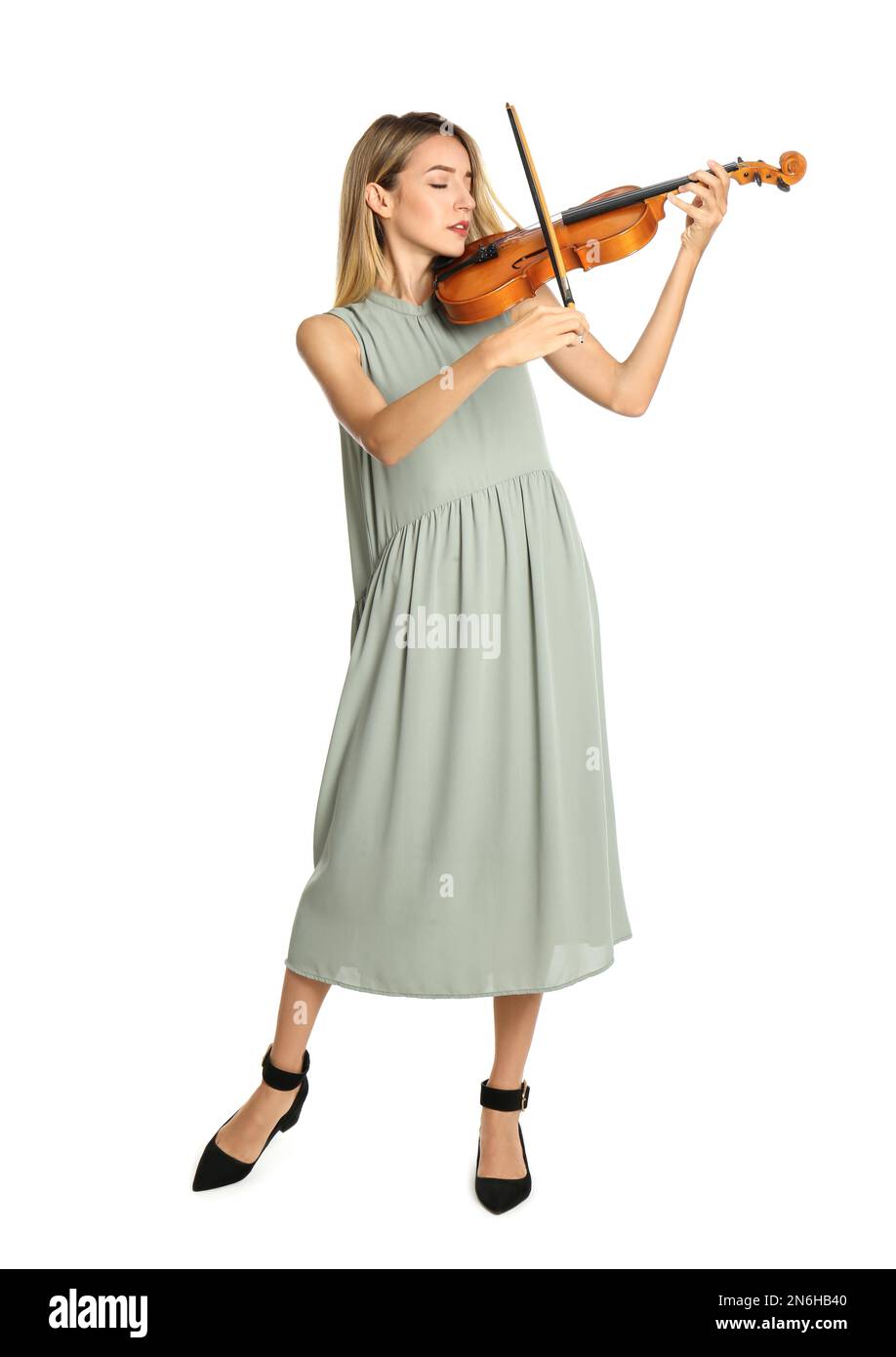 Beautiful woman playing violin on white background Stock Photo - Alamy