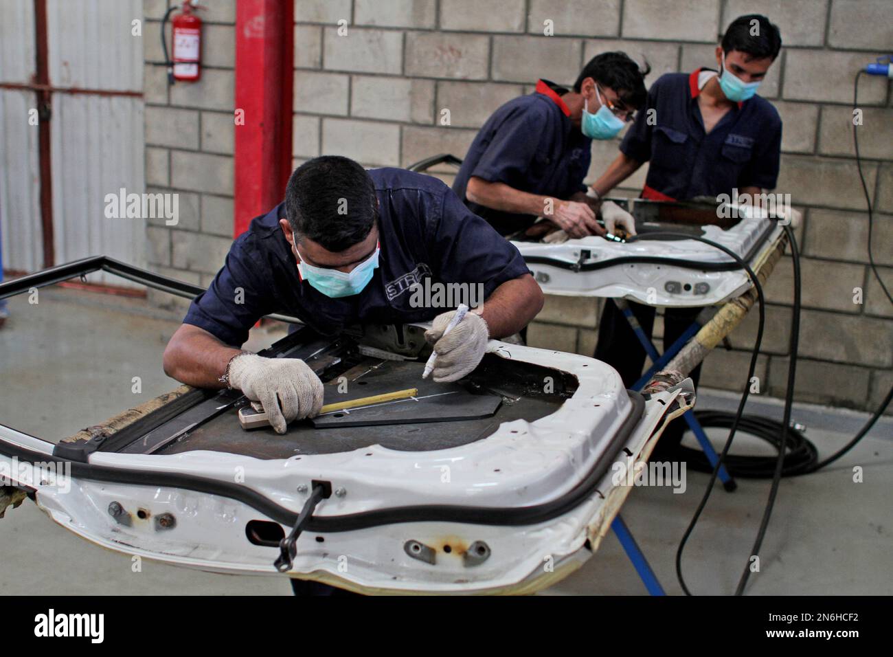 In this Friday, Sept. 6, 2013 photo, Pakistani workers prepare the ...
