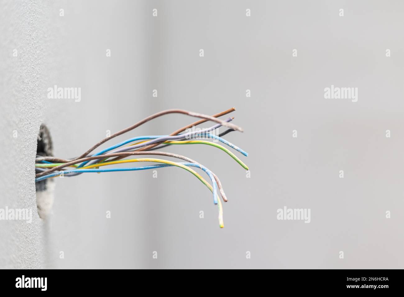 Open electric plug at home with kind of seen cables, electrical wires ...