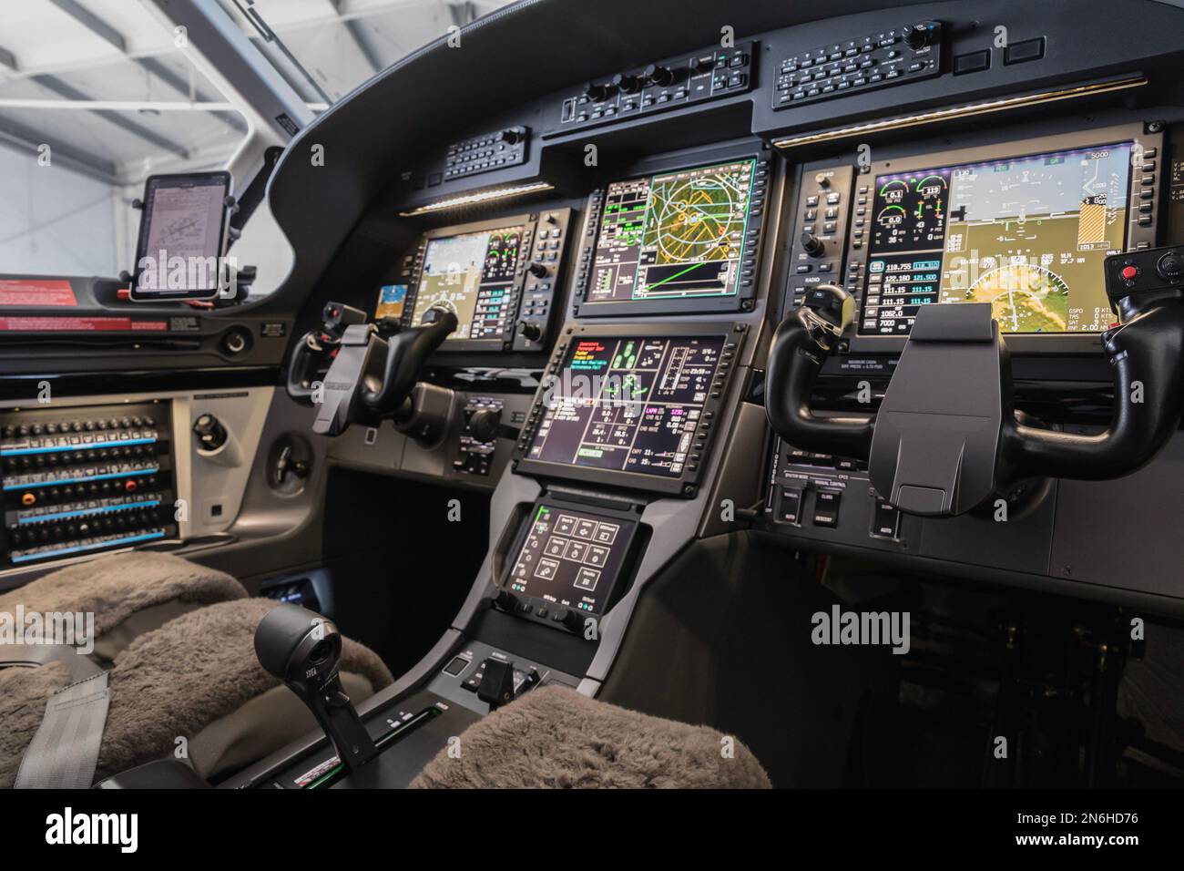 Aircraft interior, view into the cockpit of a modern turboprop aircraft ...