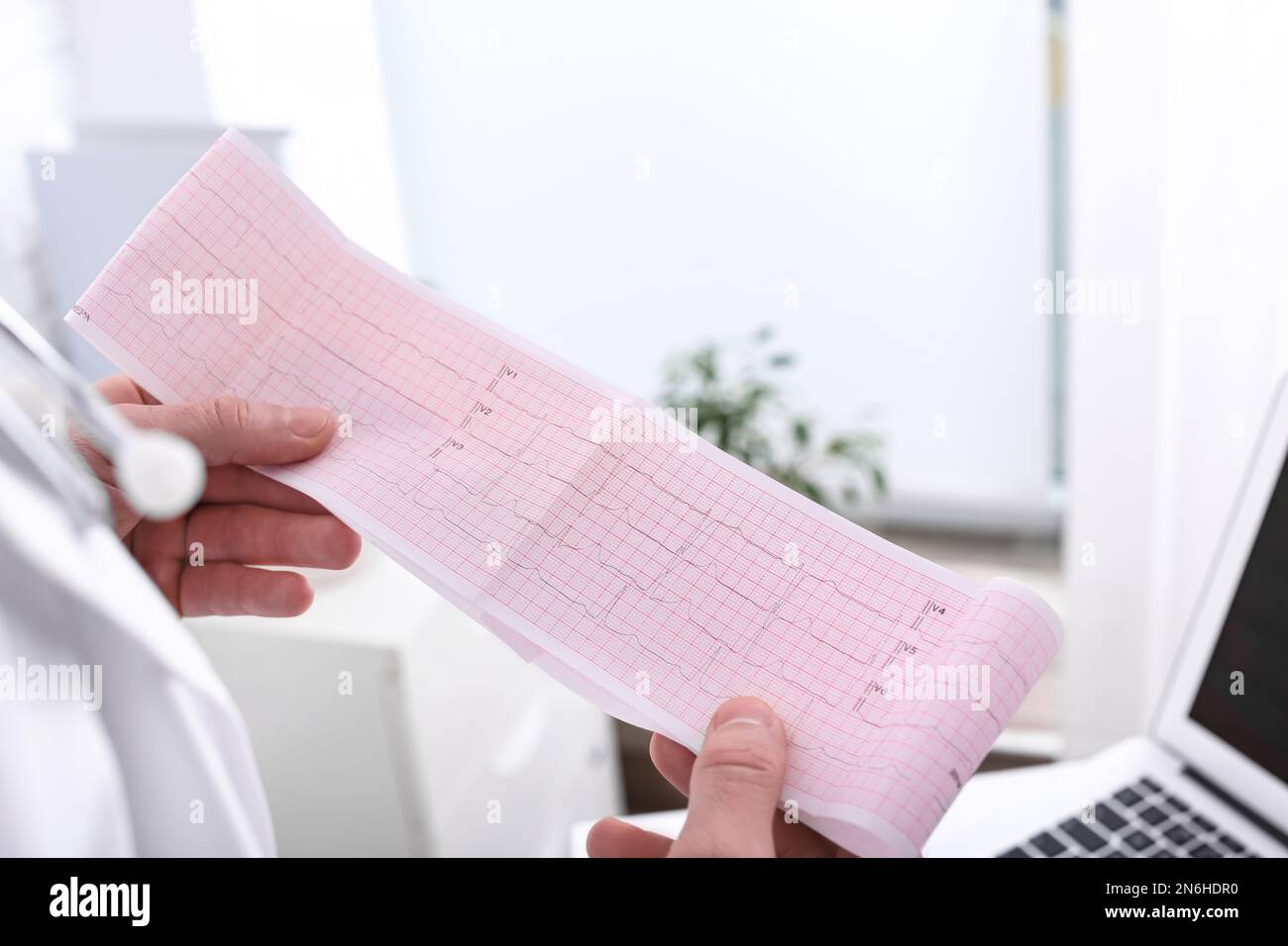 Doctor cardiologist examining electrocardiogram hi-res stock ...