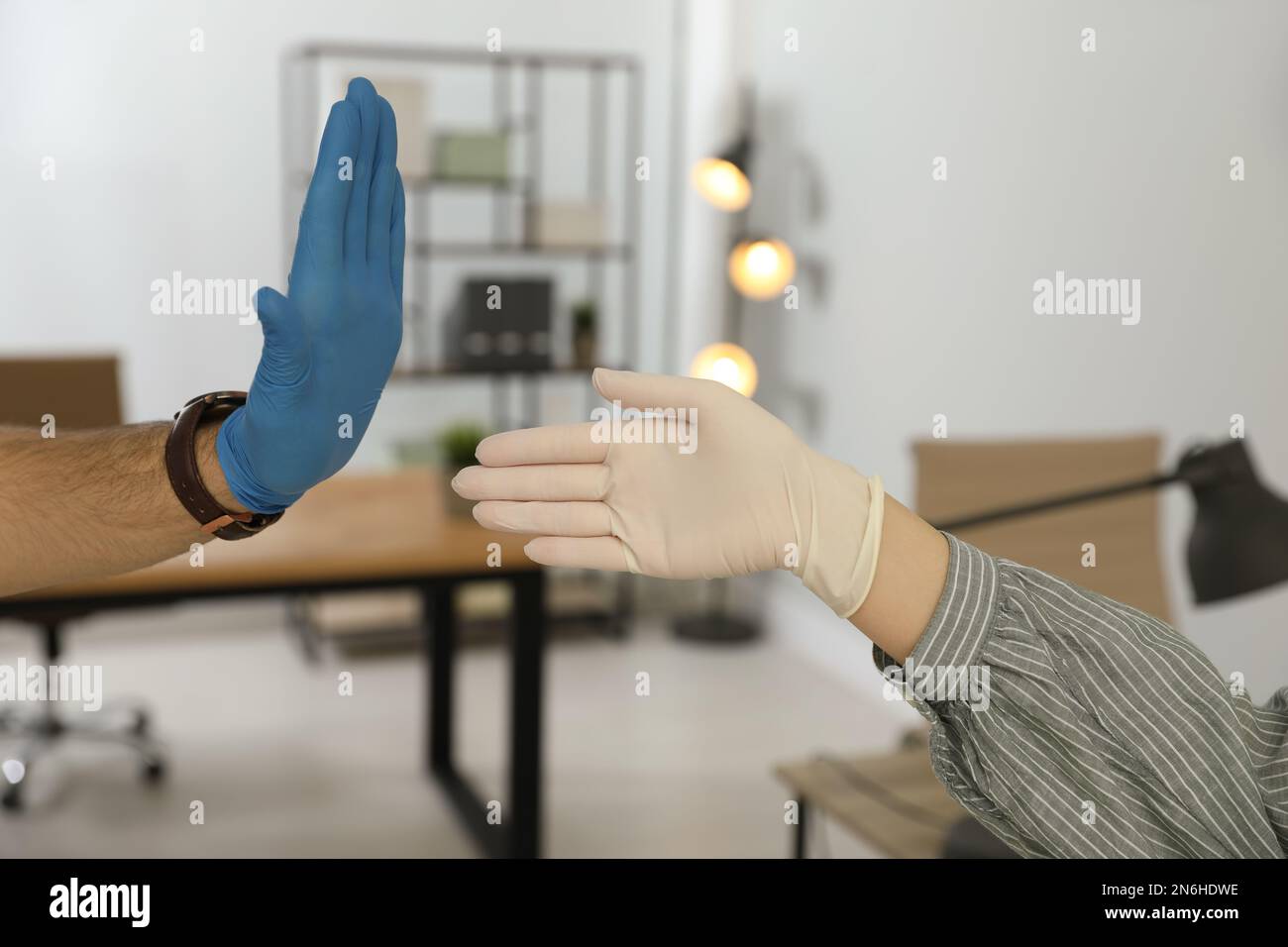 Man refusing handshake from coworker in office, closeup Stock Photo - Alamy
