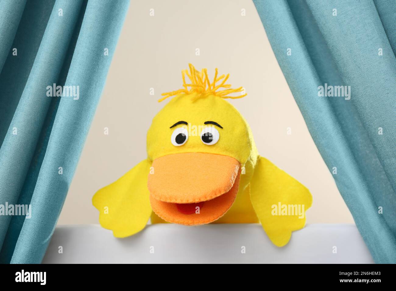 Creative puppet show on white stage indoors Stock Photo - Alamy