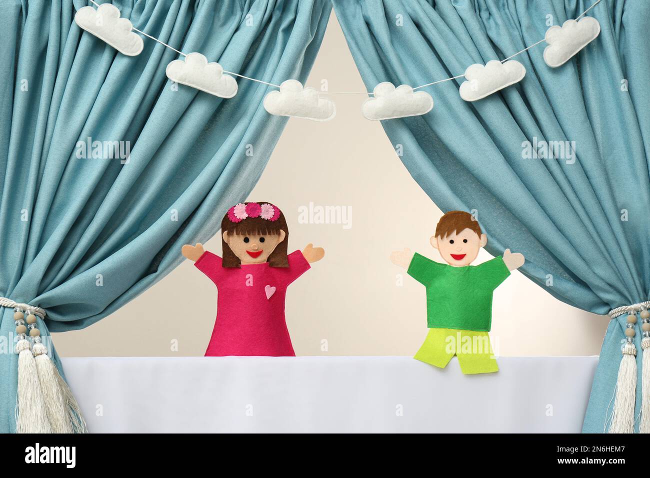 Creative puppet show on white stage indoors Stock Photo - Alamy