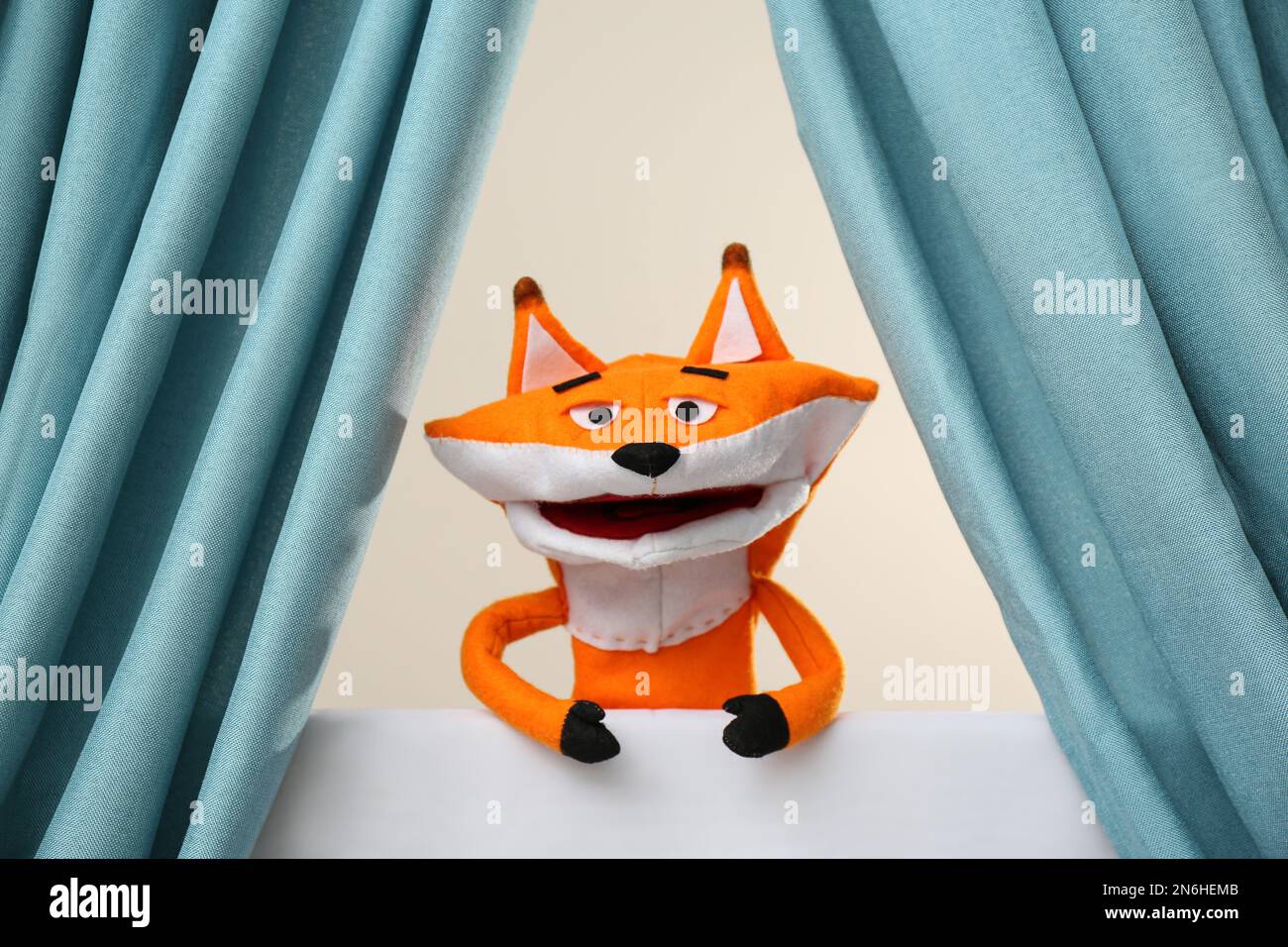 Creative puppet show on white stage indoors Stock Photo - Alamy