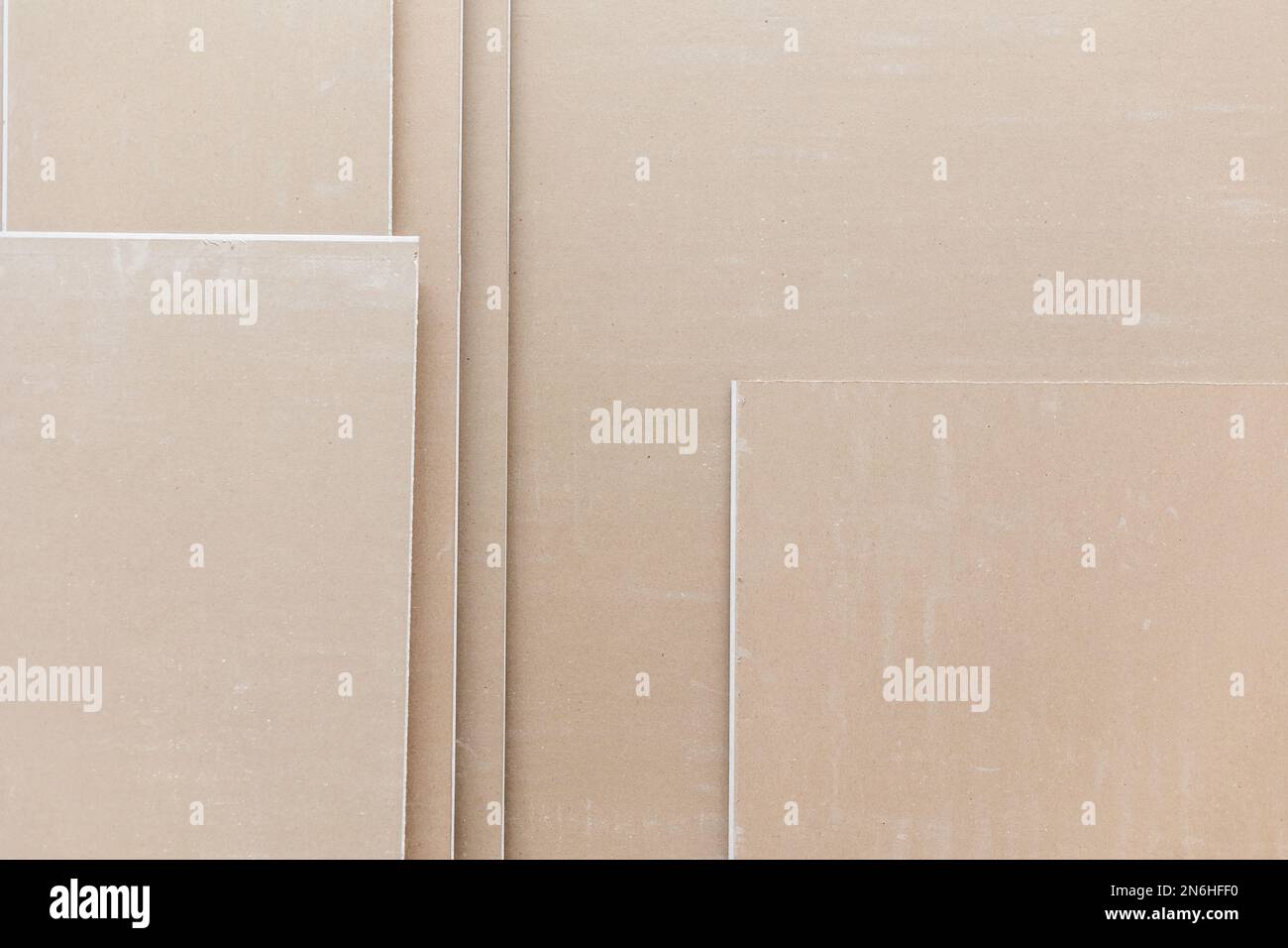 Close up of plasterboard, a type of drywall made of plaster between two ...