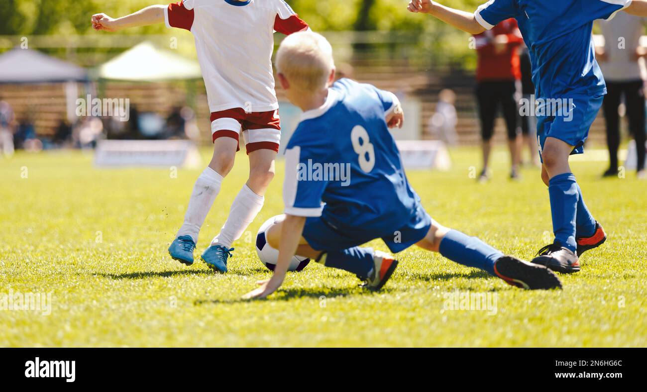 Soccer football tackle moment. Skill of tackling in soccer game. Kids ...
